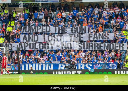 Rangers fans hold up banner in the stands during the cinch Premiership ...
