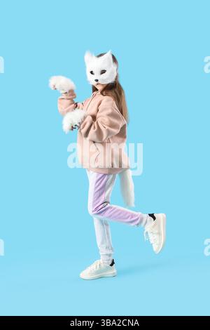 Quadrobics. Girl wearing cat mask, tail and gloves on white background ...
