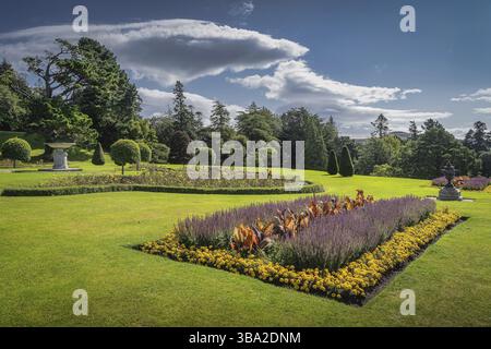 Powerscourt garden with flowerbeds, hedges, decorative trees, fountains ...