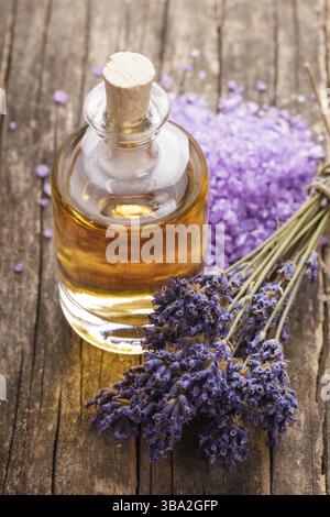 Lavender essential oil with lavender flowers, shot from the top on a ...