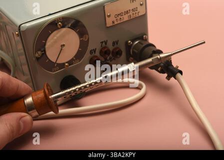 Retro soldering station. An old soldering iron with a silver tip Stock ...