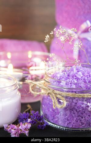 Spa products. Bath salts, dry flowers lavender, soap, candles and towel ...