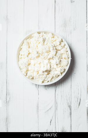 Freshly made cottage cheese in glass bowl with cheesecloth Stock Photo ...