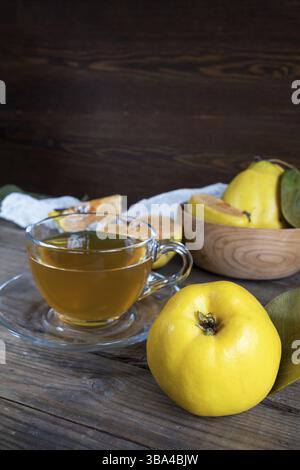 The cup of quince tea and fresh quince fruit Stock Photo - Alamy