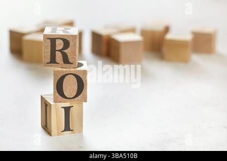 ROI letters on wooden cubes Return on Investment business concept Stock ...