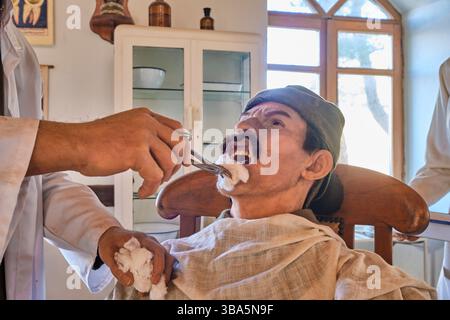 An army dentist with nurse, working on the teeth of a wounded Turkish ...