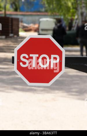 Gate and barrier of the checkpoint with a stop sign Stock Photo - Alamy