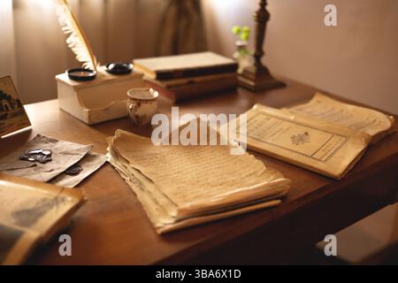 Vintage manuscripts and inkwell on the table Stock Photo - Alamy