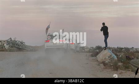 Red Cross vehicles, carrying American prisoner, Idan Alexander, leave ...