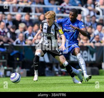 Newcastle United's Anthony Gordon (left) is fouled by Crystal Palace's ...