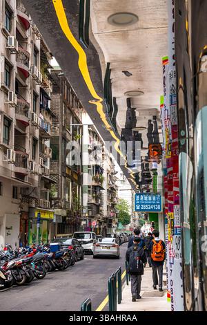 Old town street in Macau, historical chinese and portuguese buildings ...