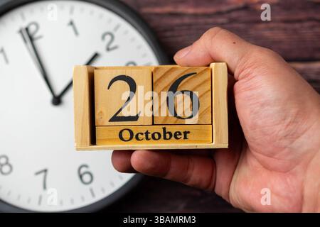 Daylight Savings Time Spring concept flat lay with white clock and ...