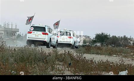 Red Cross vehicles, carrying American prisoner, Idan Alexander, leave ...