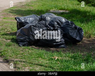 Big heap of trash bags with garbage on white background Stock Photo - Alamy