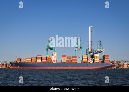 Norfolk, VA, US-May 1, 2025: Large international cargo ships in harbor ...