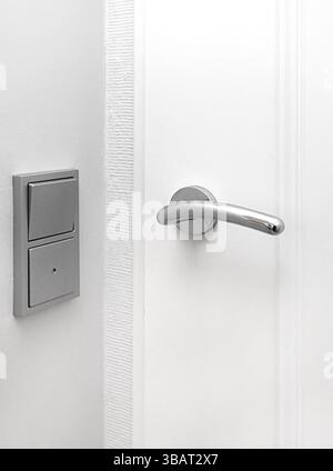 Light switch and door handle Stock Photo - Alamy