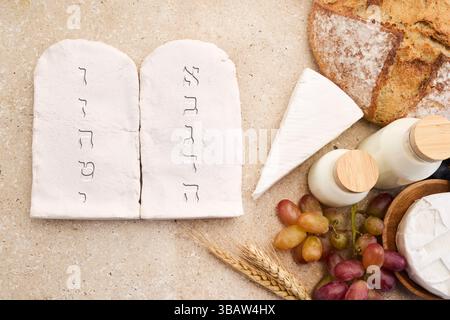 Happy Shavuot concept. Two Stones with Ten Commandments in Ancient ...
