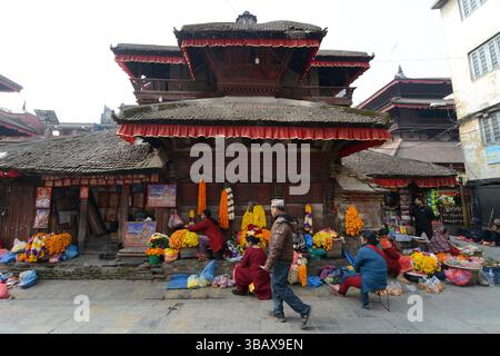 A colorful flower market by an old Newari house in the Durbar Square ...