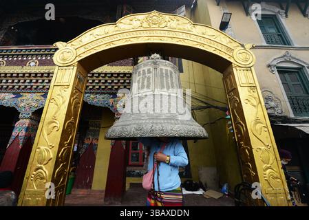 The golden arch and bell at the Boudhanath Stupa in Kathmandu, Nepal ...