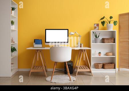 Interior of office with workplace, shelf units and glowing lights at ...