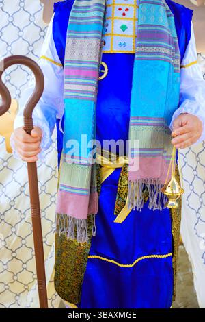 Jewish high priest dressed in ceremonial clothing holds staff ...