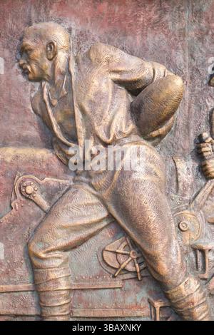 Corporal Seyit, carrying an artillery shell. In the long, bronze frieze ...