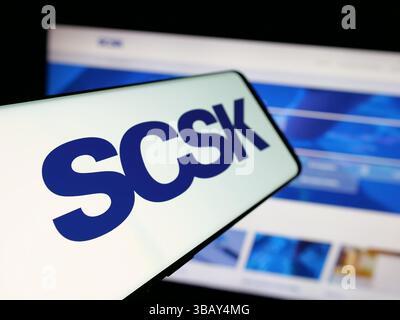 In this photo illustration, the SCSK Corporation company logo is seen ...