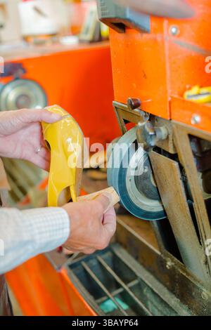 cobbler sanding shoe Stock Photo - Alamy