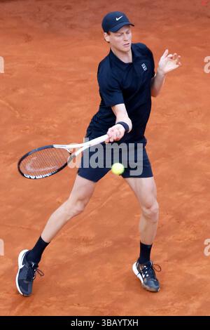 Italy's Jannik Sinner returns the ball to Germany's Alexander Zverev ...