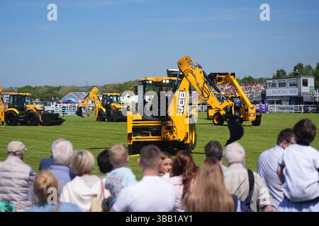People watching 'JCB Dancing Diggers' during the first day of the ...