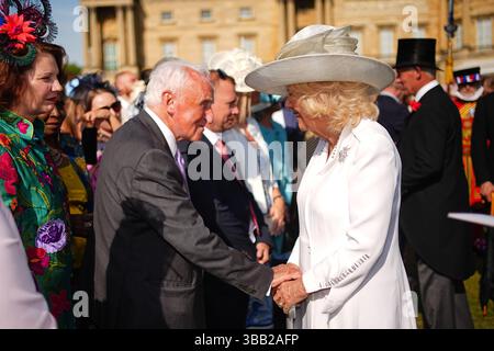 Queen Camilla meets members of the public as she leaves after opening ...