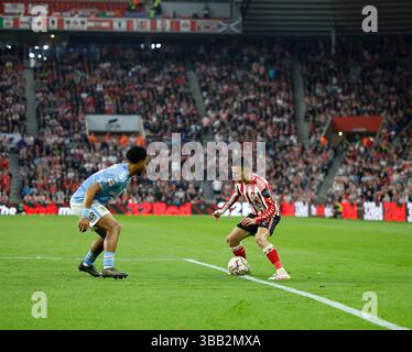 Enzo Le Fee of Sunderland looks to get away from Harrison Armstrong of ...