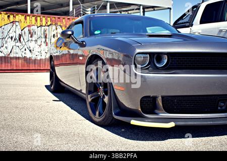 Aggressive Dodge Challenger SRT in Urban Show Setting Stock Photo - Alamy