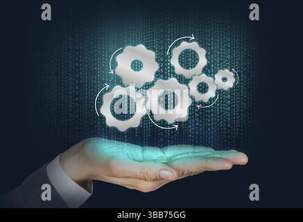Gears mechanism floats on the human hand over digital background Stock ...