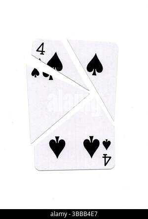 A vintage playing card cut into sharp pieces on a white background ...