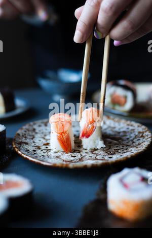 Asian seafood meal, chopsticks using for eating Stock Photo - Alamy