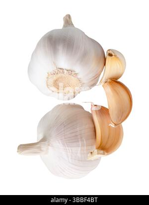 Side view of three unpeeled garlic cloves or pieces in stack is ...