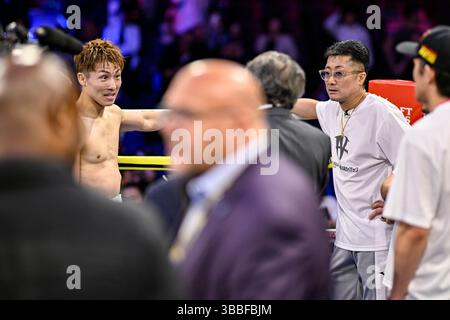 Champion Japan's Naoya Inoue stands with his brother Takuma Inoue, left ...
