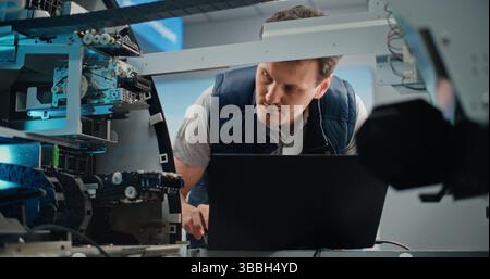 Technician Servicing ATM Machine in Modern Airport Terminal. Male ...