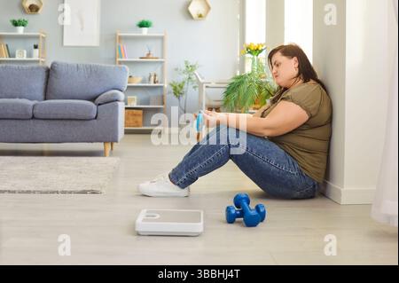 Sad Obese Woman Training in Gym Stock Photo - Alamy