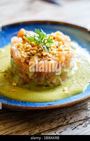 Cured salmon tartar with acevichado avocado and toasted corn dressing ...