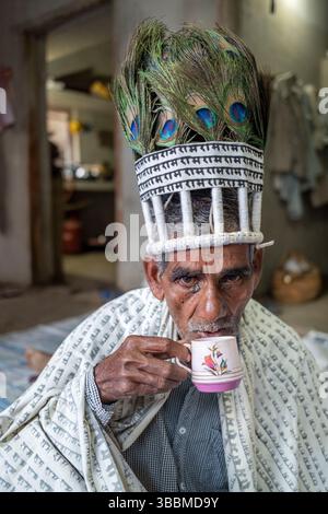With Ram tattoos and printed on shawls, and wearing peacock feather ...