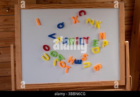 Colorful Magnetic Letters "family" on a Wooden Frame Whiteboard in ...