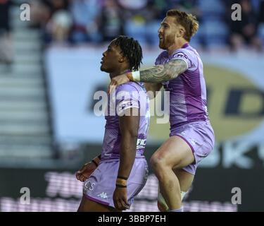 Wigan Warriors' Junior Nsemba scores his sides third try during the ...