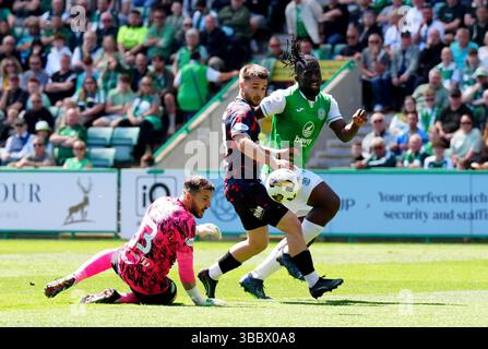 Hibernian goalkeeper Jordan Smith (centre) makes a save during the UEFA ...