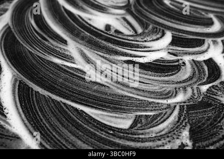 Abstract white soap curved lines on black background Stock Photo - Alamy
