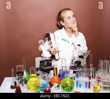 Female teacher near blackboard in classroom Stock Photo - Alamy