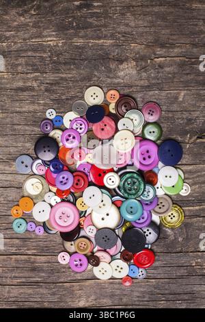 Sewing Colorful wooden buttons on white background Stock Photo - Alamy