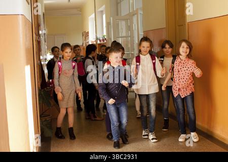 Happy pupils running out of the classroom on summer vacation Stock ...