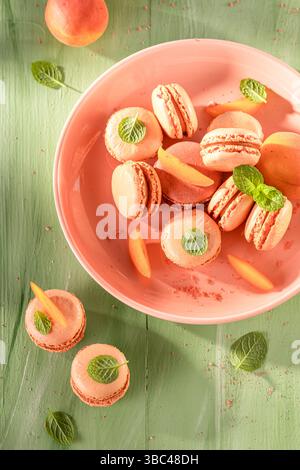 Homemade and sweet peach macarons made of juicy fruit. Sweet macarons ...